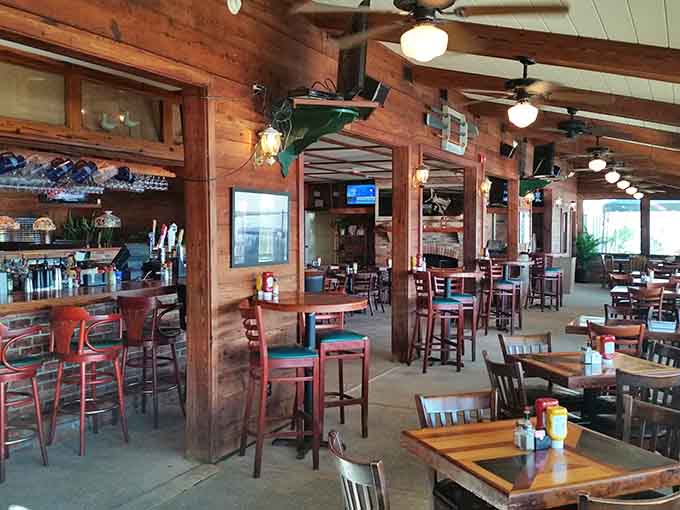 Dark wood, ceiling fans, and a full bar. Marshside Grill's interior feels like a warm coastal embrace.
