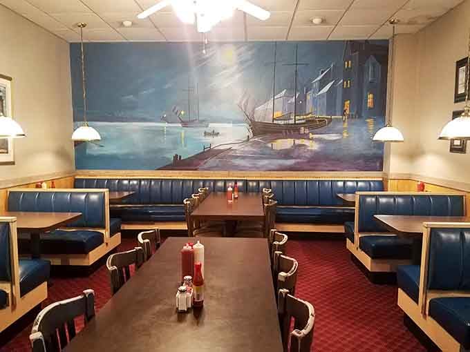 Blue vinyl booths, a harbor mural, and zero pretension. This is exactly where you want to spend a Tuesday evening.