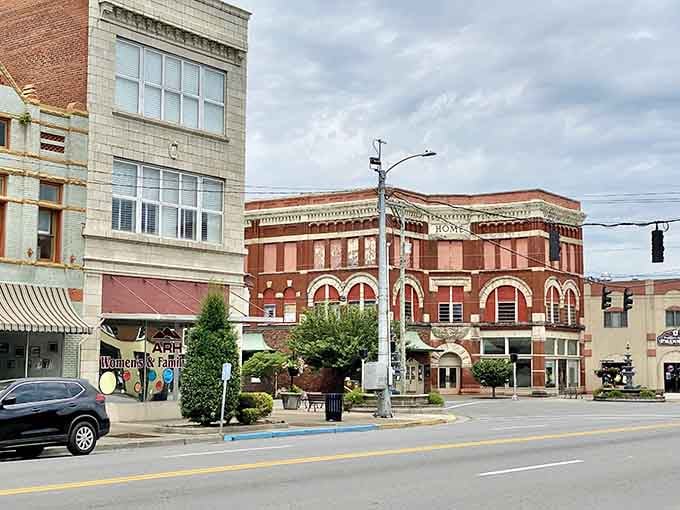 Brick facades, American flags, and mountain ridges framing the skyline make this downtown feel genuinely cinematic.