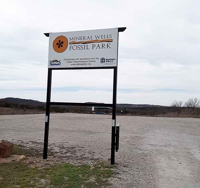 The Mineral Wells Fossil Park sign stands proud, marking the entrance to Texas's most generous time machine.