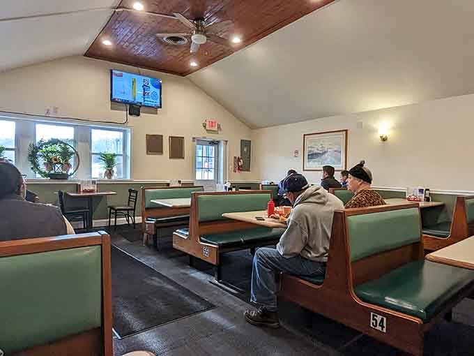 Green vinyl booths, a ceiling fan, and a TV on the wall. This is comfort dining done exactly right.