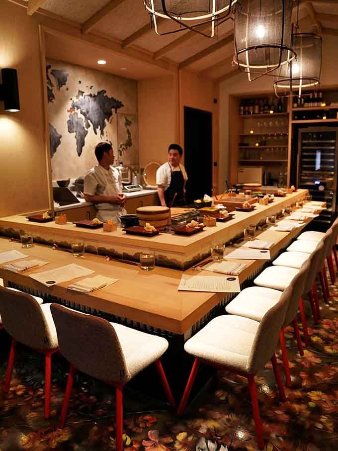 When the chefs are this close, dinner stops being a meal and quietly becomes something closer to a front-row seat at a masterclass.