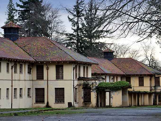 Pale yellow walls and terracotta tiles give this asylum an architectural elegance that makes the history even stranger.