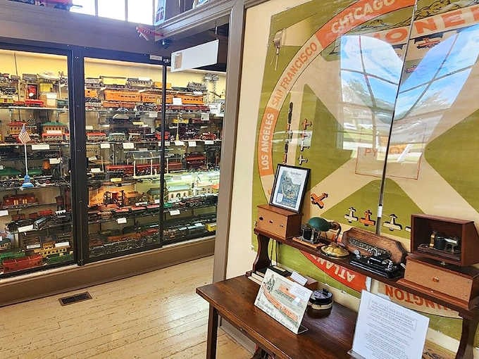 Floor-to-ceiling glass cases packed with vintage trains, this room is basically a time machine you can walk right into.