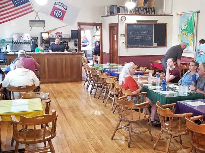 Hardwood floors, wooden chairs, and an 82nd Airborne flag. This dining room has more character than most restaurants twice its size.