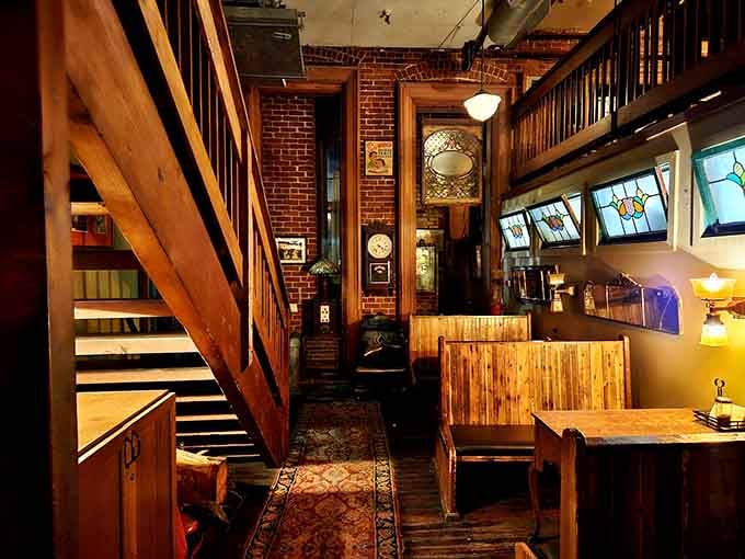 Exposed brick, stained glass, Persian rugs, and a staircase that goes somewhere interesting. This room has serious stories to tell.