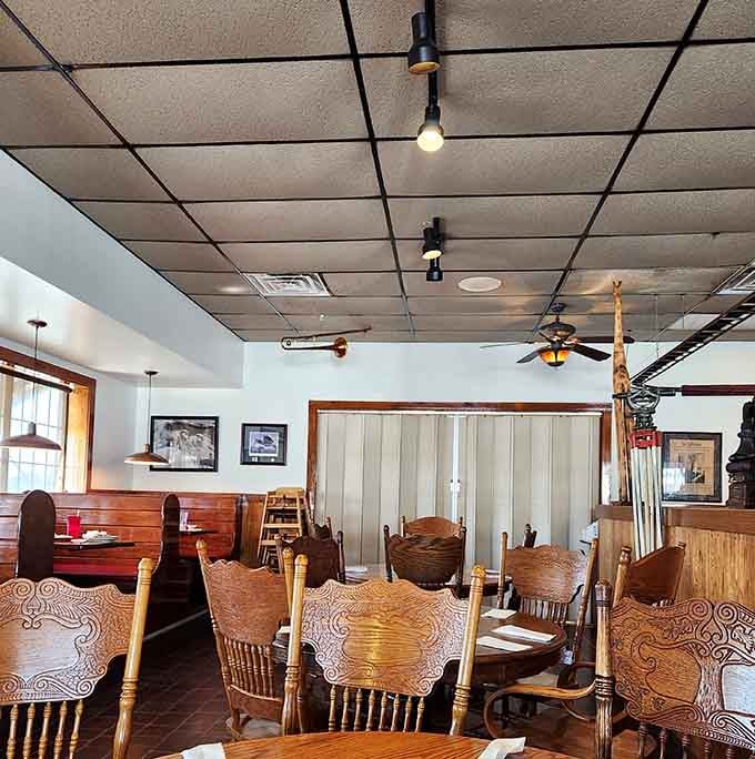 Step inside where wooden chairs and warm lighting create the perfect setting for serious eating.