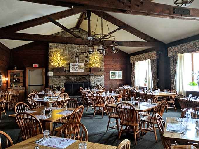 Exposed beams, a stone fireplace, and Windsor chairs, this dining room feels like a mountain lodge that also happens to feed you brilliantly.