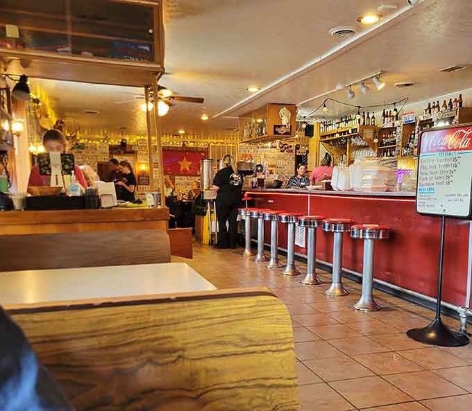 Chrome stools, warm lighting, and a Vietnamese flag on the wall. Perky's has layers, just like the best people do.