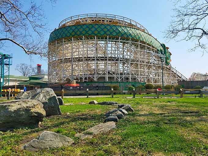 The Dragon Coaster's iconic green and gold dome stands proud, a wooden legend that's been rattling happy bones for generations.