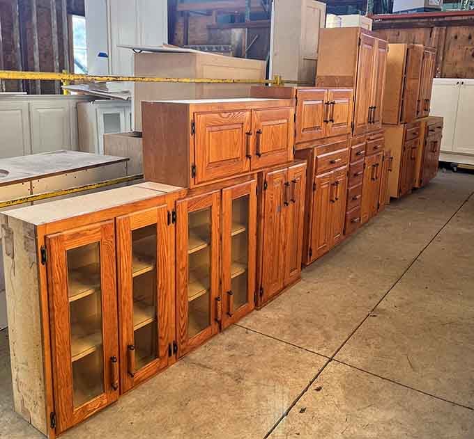 These warm oak kitchen cabinets with glass fronts are basically the holy grail of budget-friendly home renovation finds.