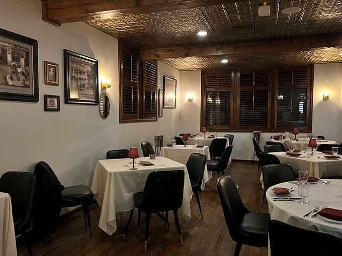White tablecloths, warm lighting, and a pressed tin ceiling that says, "You made a very good decision tonight."