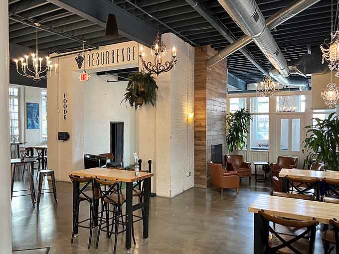 High ceilings, warm wood, and chandeliers that somehow make perfect sense, this is brewery design done absolutely right.