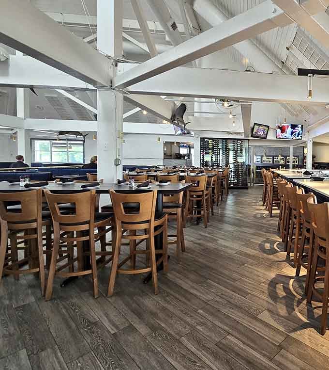 High ceilings, warm wood floors, and a wine wall that means business. Welcome inside.