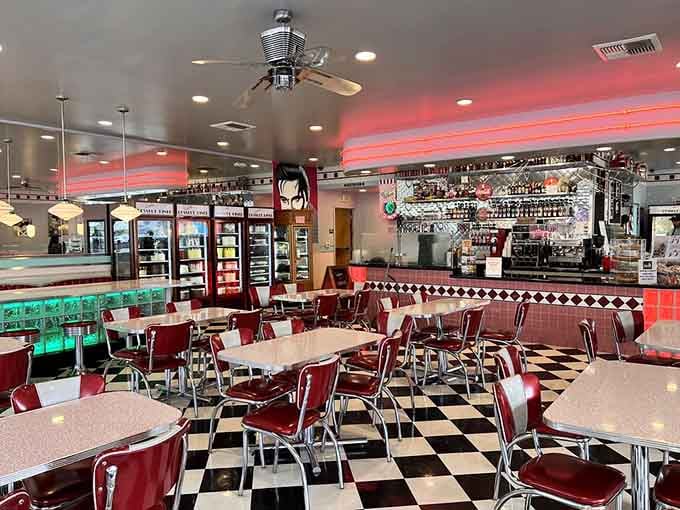 Red vinyl, checkered floors, and neon glow, this room was designed to make you feel genuinely happy.