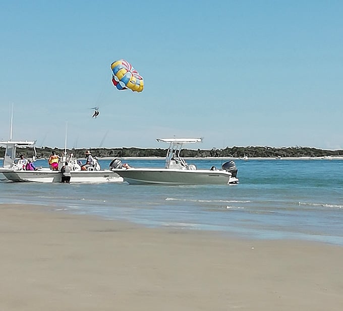 When the beach has its own air show, you know you've found somewhere special. Parasailing over Sand Dollar Island never gets old.