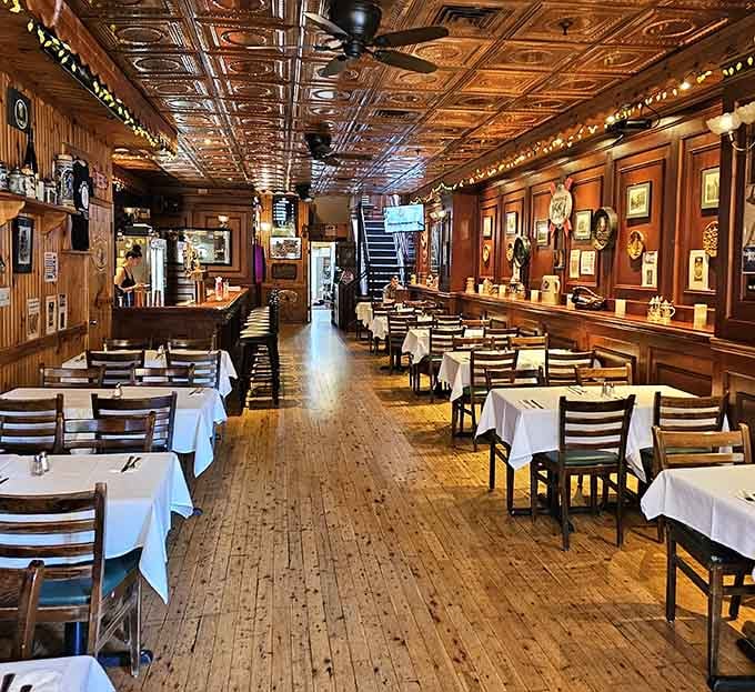 Dark wood panels, pressed tin ceilings, and white tablecloths. This room means serious business.