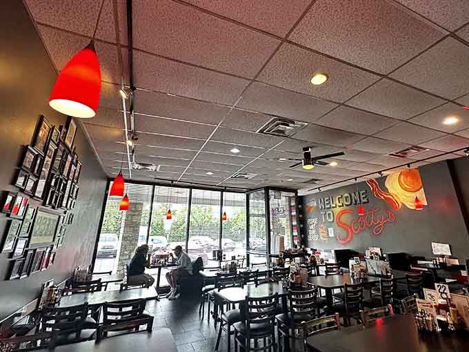 Red pendant lights, a welcoming mural, and the kind of warmth that makes you forget you ever had lunch plans elsewhere.