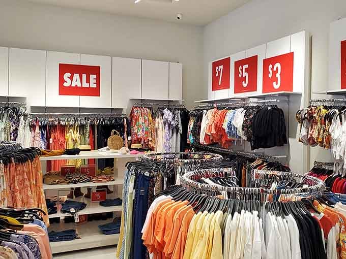 Racks packed with color and sale signs everywhere. This is what a good shopping day looks like.