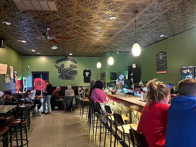Green walls, an ornate pressed tin ceiling, and the warm hum of people genuinely happy to be here.