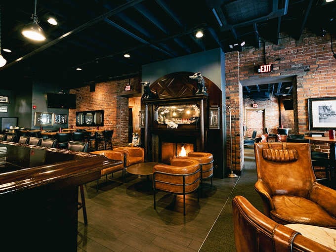 Leather chairs, a crackling fireplace, and exposed brick walls that practically whisper, "Stay a while, friend."