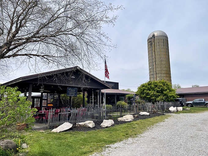 The classic silo standing sentinel proves this isn't some manufactured farm experience—this is the real deal.
