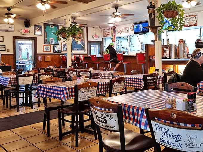 Checkered tablecloths, ceiling fans, and walls full of memories. This dining room has seen a thousand good meals and counting.