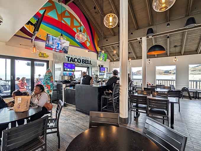 Inside the Taco Bell Cantina Pacifica, the bar, the mural, and the ocean view all compete for your attention.
