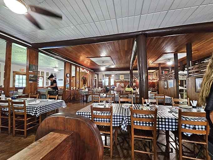 Black-and-white checkered tablecloths, warm wood beams overhead, and the kind of room that makes you exhale completely.
