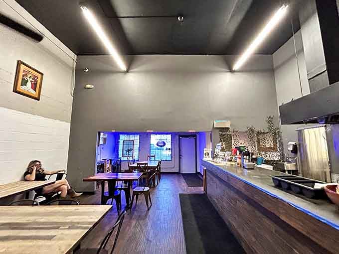 Simple, cool, and completely unpretentious. The blue lighting says "relax, the food will do the talking."