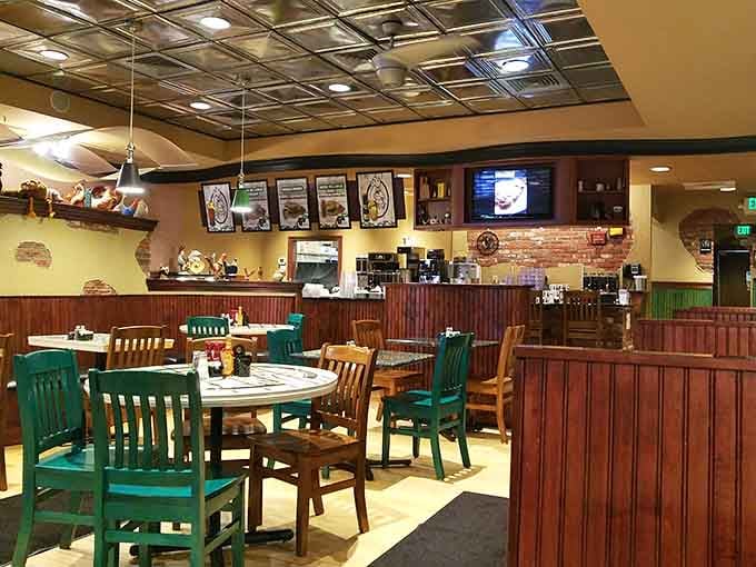 Warm yellow walls, teal chairs, and a pressed tin ceiling that says "stay a while and eat well."