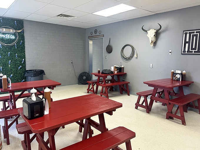 Bold red picnic tables, a longhorn skull, and a "HOWDY" sign. Texas arrived in Colorado and stayed.
