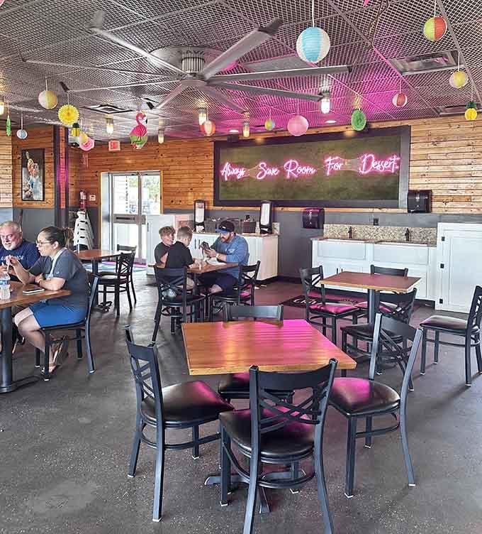 Warm wood walls, colorful lanterns, and a neon sign that speaks the truth: "Always Save Room For Dessert."