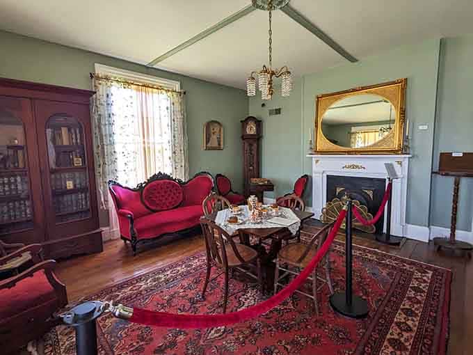 Red velvet sofas and gilded mirrors. Someone had excellent taste before the war changed everything.