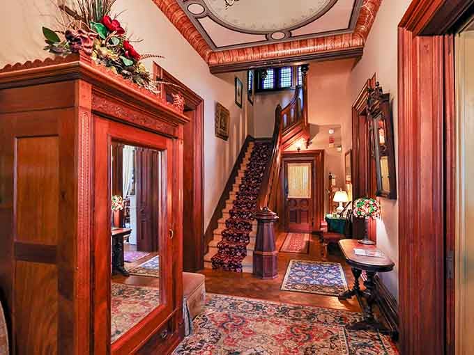 That carved staircase isn't just a staircase. It's a daily reminder that 1874 had absolutely no interest in cutting corners.