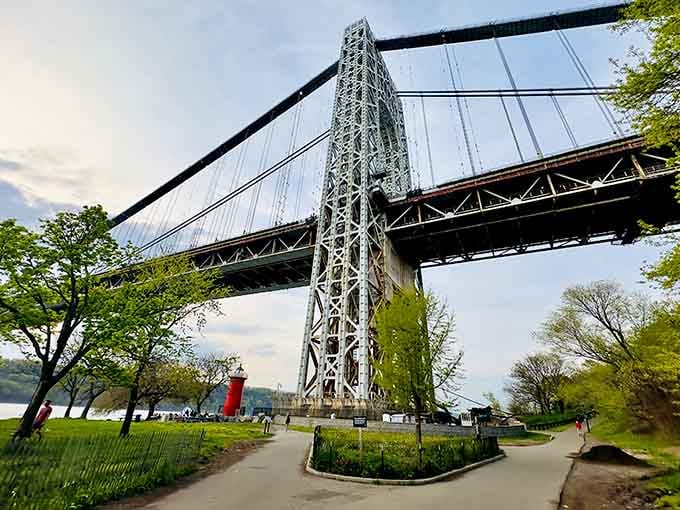 The path to the lighthouse feels like a stroll through a postcard, with the GWB looming gloriously overhead.