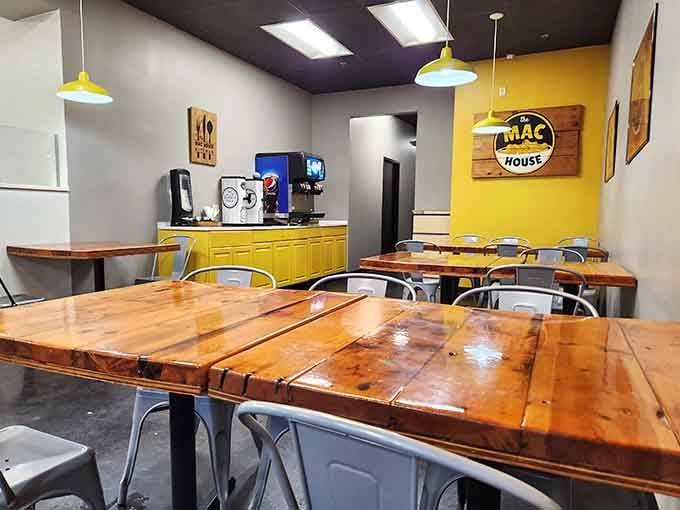 Those cheerful yellow accents and rustic wooden tables create the kind of welcoming space where comfort food feels right at home.