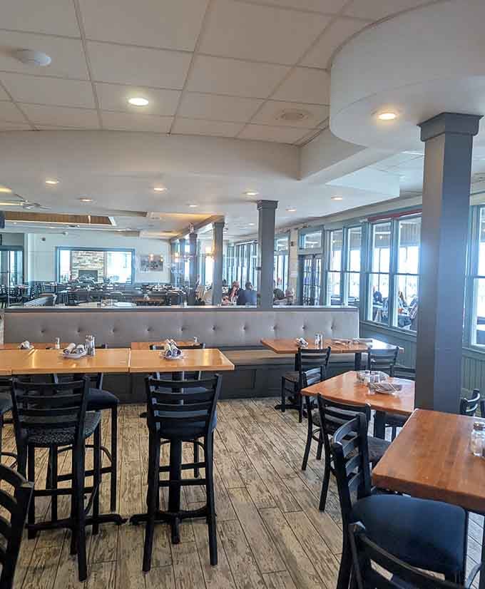 Bright windows, warm wood tables, and tufted banquettes. This dining room means serious, comfortable business.