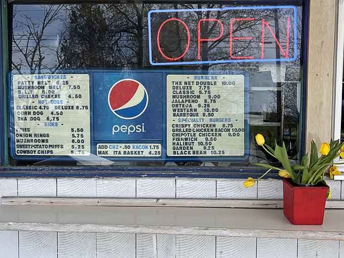The menu board says it all: burgers, seafood, and sides that cover every craving you didn't know you had.