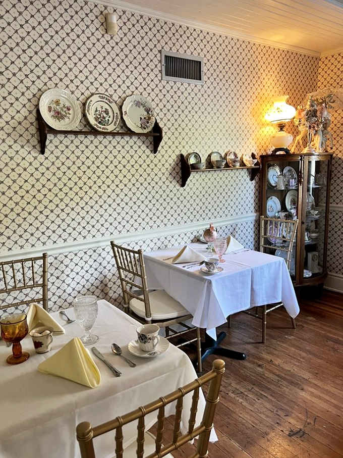 White linens, vintage china, and wallpaper that whispers elegance, this is teatime done absolutely right.