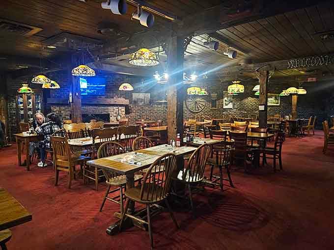 Tiffany lamps and exposed brick create an atmosphere where time slows down and conversations flow as freely as the beer.
