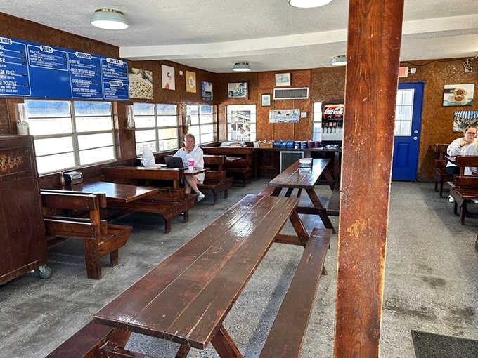 Worn wooden booths and blue menu boards tell you everything: this place feeds people, not Instagram feeds.