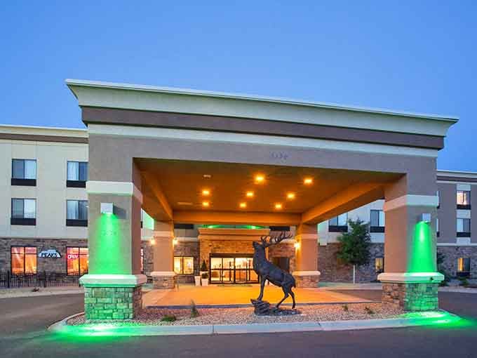 The Holiday Inn Express welcomes you with a proud elk statue, because Trinidad does nothing halfway.
