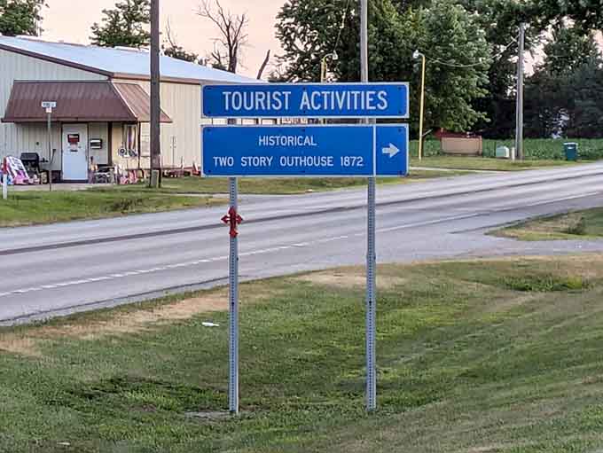 When a highway sign points you toward a two-story outhouse, you follow that arrow without question.