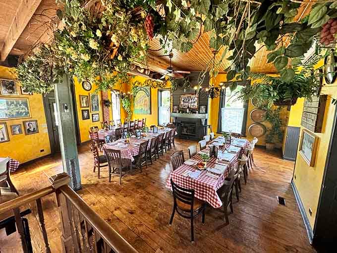 Yellow walls, checkered tablecloths, and hanging greenery create the Italian restaurant of your nostalgic dreams.