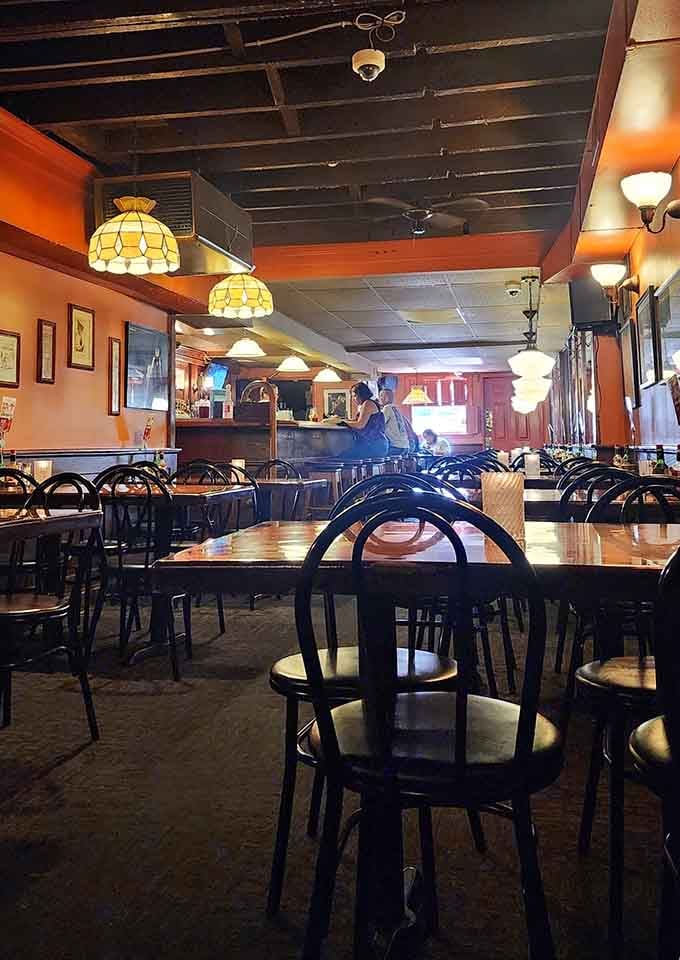 Warm wood, Tiffany lamps, and dark ceiling beams, this is what a neighborhood restaurant looks like when it gets everything right.