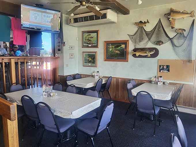 Mounted fish on the walls, ceiling fans overhead, and the kind of cozy vibe that says "stay awhile."