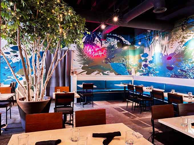 That indoor tree with twinkling lights and the glowing "life is beautiful" sign set the mood perfectly.