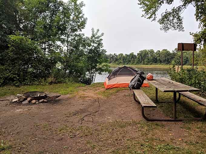 A tent, a fire pit, and a river view &mdash; this campsite just made your living room feel inadequate.
