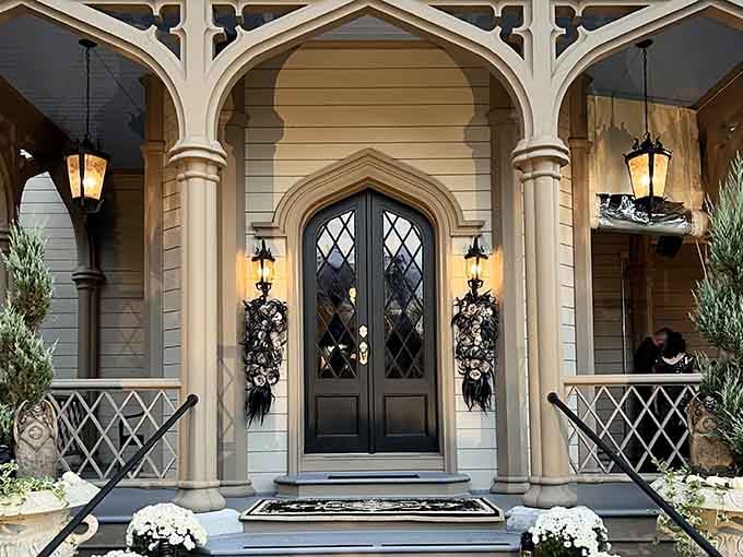 That front door means business. Gothic arches, diamond glass, and lanterns that whisper "you've arrived somewhere special."
